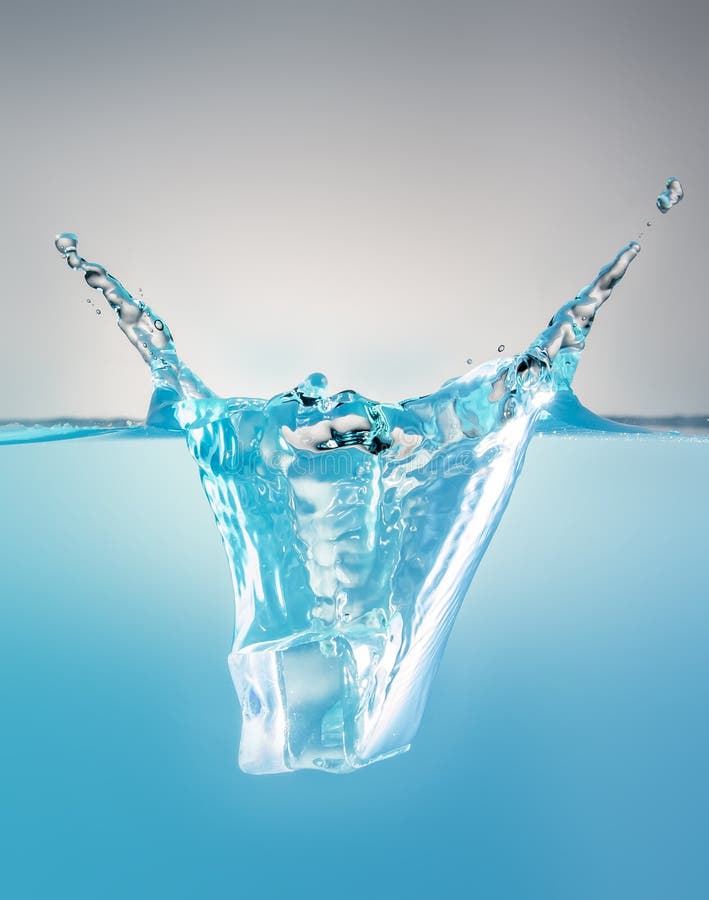 Object Falling into Blue Water until Splashing on a Gray Background ...