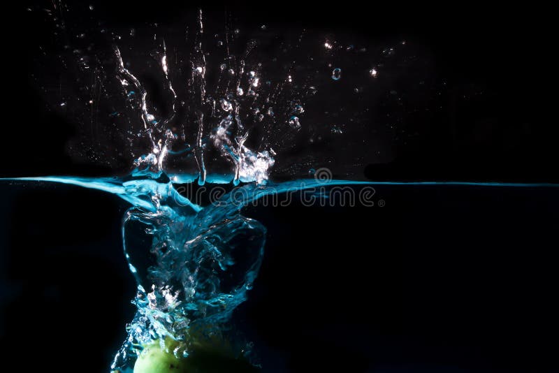 The Object Falls into the Blue Water until a Sponge Splits Beautifully ...