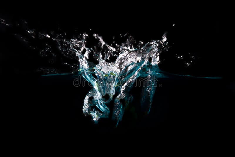 The Object Falls into the Blue Water until a Sponge Splits Beautifully ...