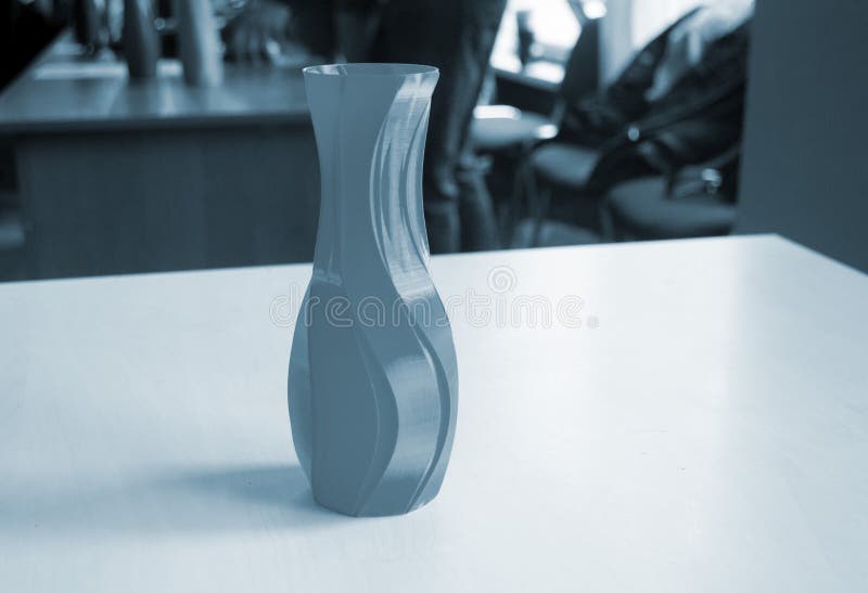 Object Form Vase of Blue Color Printed on a 3D Printer. Three ...