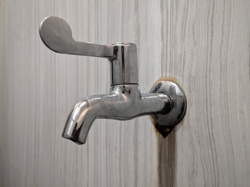 Object of a Metal Water Tap Attached To a Ceramic Wall, a Place for ...