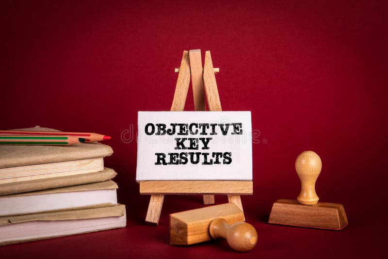 Objective Key Results. Miniature Easel on a Red Background Stock Photo ...