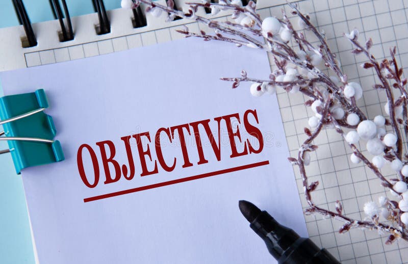 OBJECTIVES - Words on a White Sheet in a Notebook with a Pen Stock ...