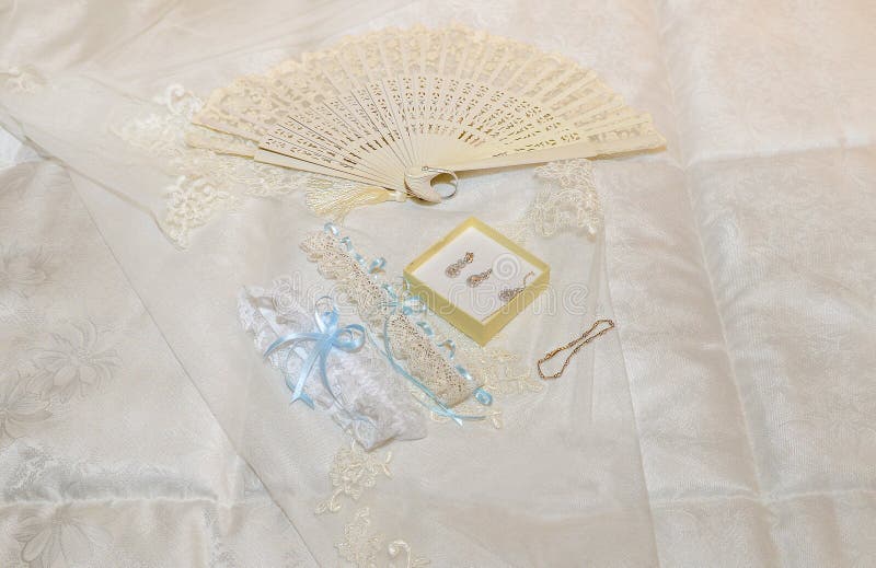 Objects and Accessories that the Bride Uses on Her Wedding Day on a Bed ...