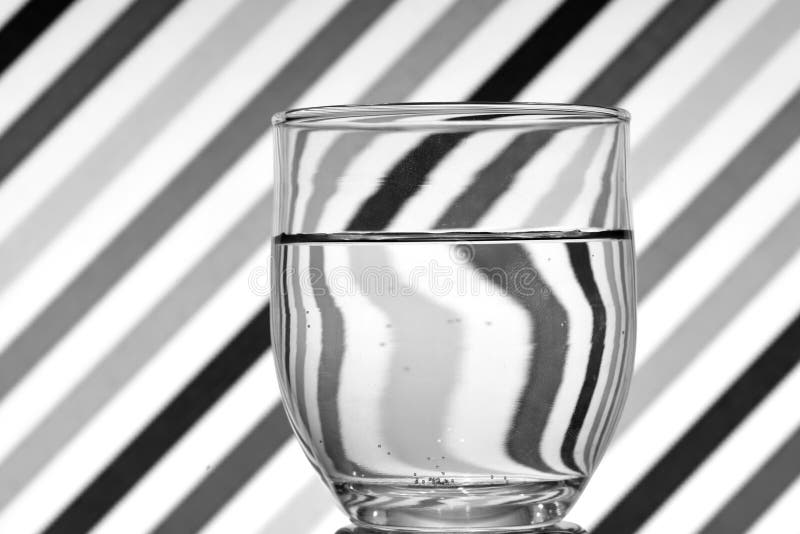 Oblique Black and White Lines Reflected in a Glass of Water Stock Photo ...