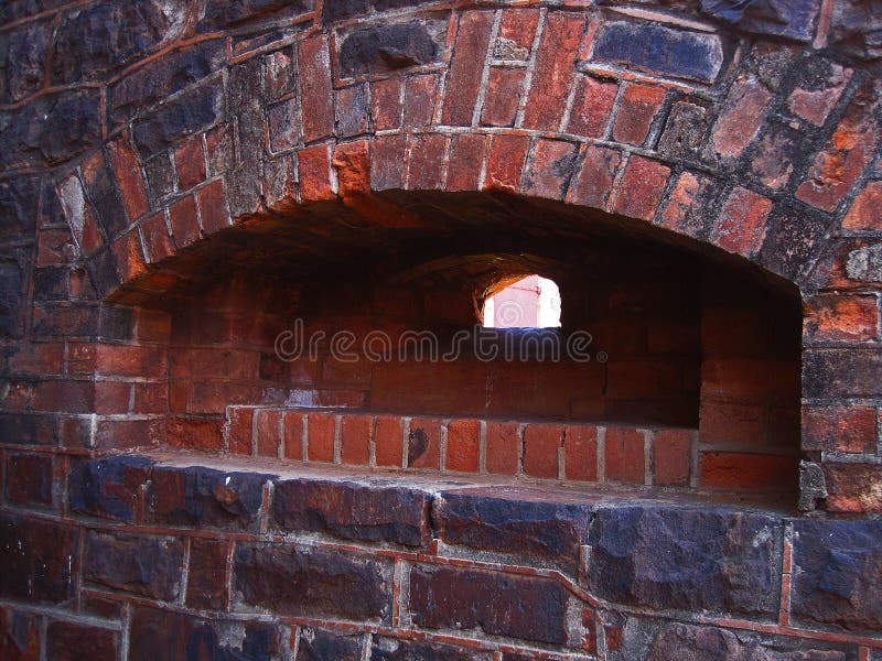 ARCHED FRAME of BRICK AROUND SMALL WINDOW OPENING in OLD FORT WALL ...