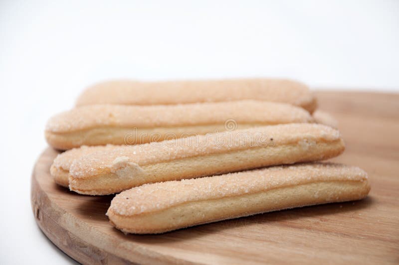 Oblong Cakes Lined Up on a Wooden Board Stock Photo - Image of ...
