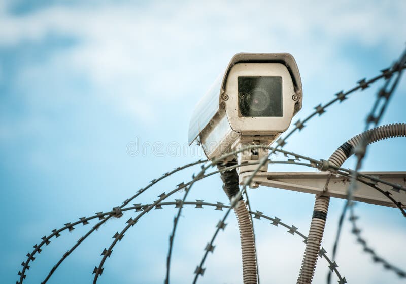 Observation Camera and Barbwire on Blue Sky. Stock Image - Image of ...