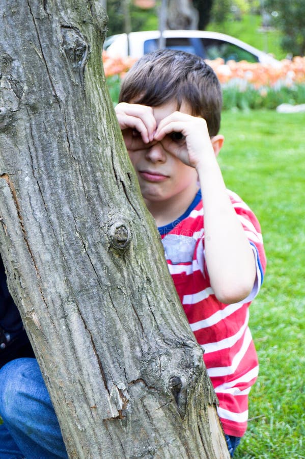 Child Peeking Around Tree Stock Photos - Free & Royalty-Free Stock ...