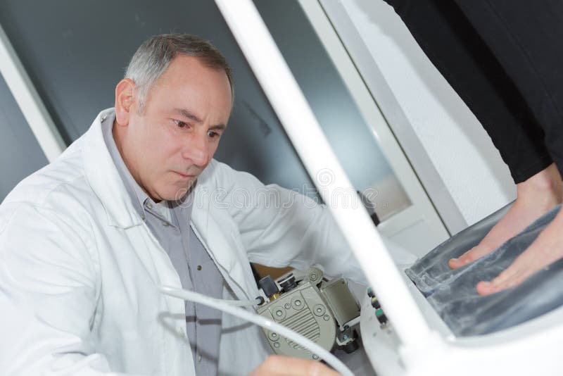 Observing the Patients Feet Stock Photo - Image of assisting ...