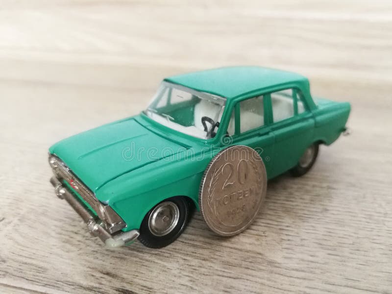Car Model Toy in Comparison with Old Coin Stock Photo - Image of ...