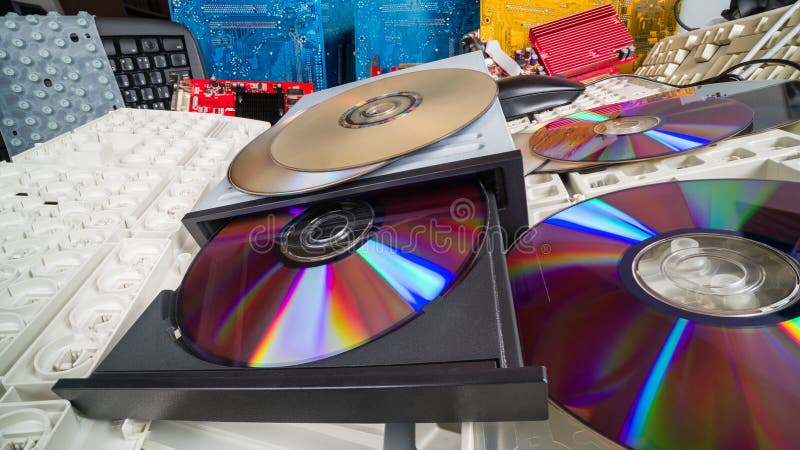 Compact Discs and Keyboards in a Heap of Old Computer Parts. E-waste ...