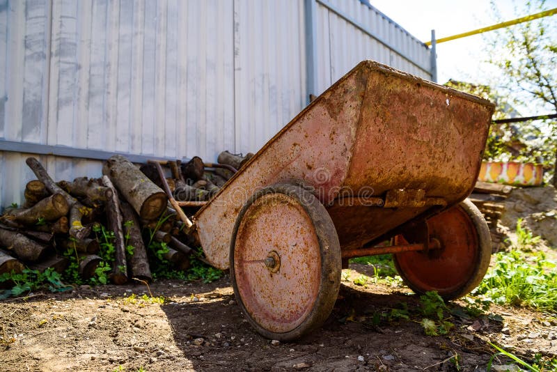 Old Rusty Wheelbarrow in Garden Stock Image - Image of dilapidation ...