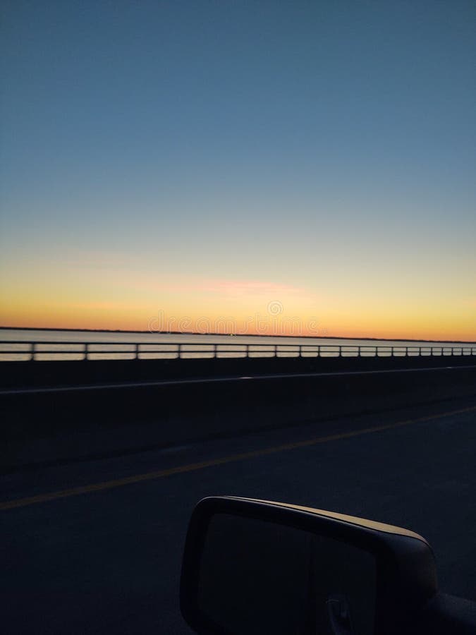 OBX bridge at sunrise stock photo. Image of black, lighting - 189579738