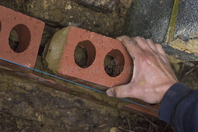 Occupation: Bricklayer Placing a Brick - Construction Industry. 2 Stock ...