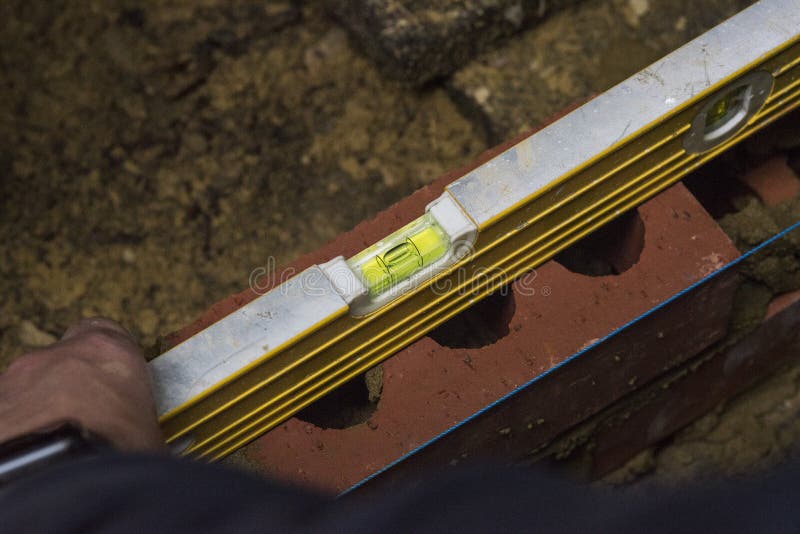 Occupation: Bricklayer Using a Spirit Level - Construction Industry. 1 ...