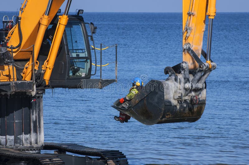 EXCAVATOR in WATER stock image. Image of excavator, coast - 74091383