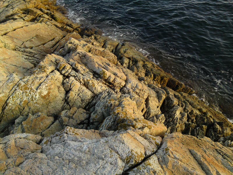 Ocean Against Rocks stock photo. Image of rocks, texture - 58281182