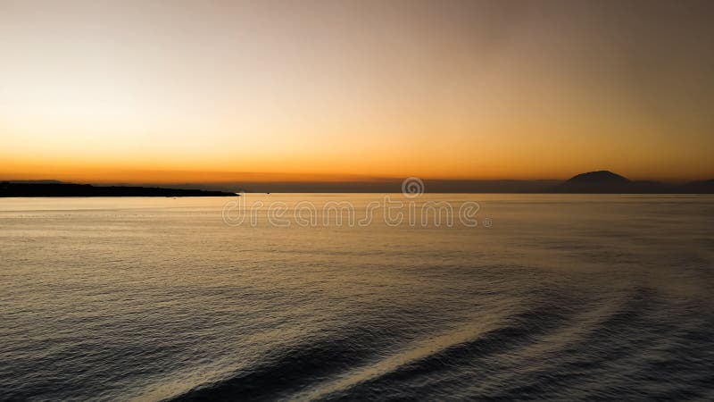 Ocean against the sunset stock photo. Image of sunset - 173513422