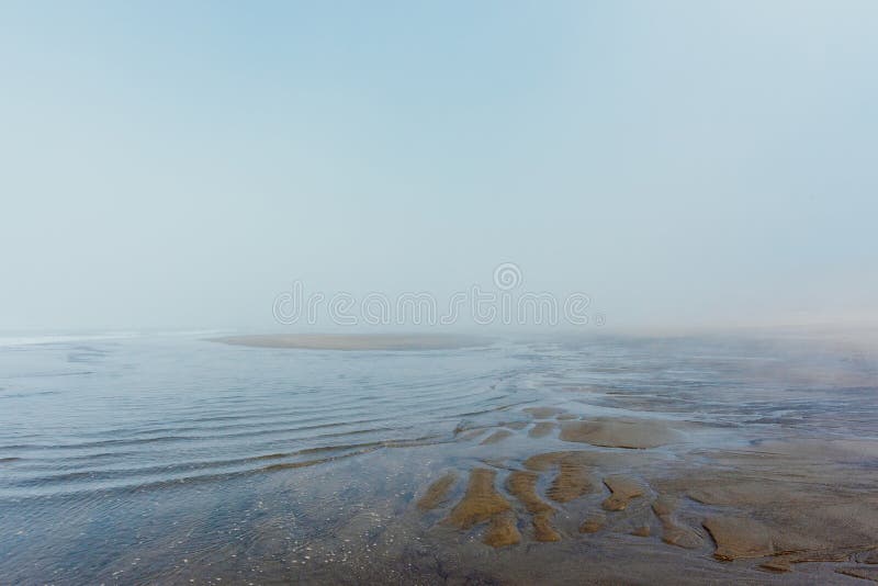 Ocean beach in dense fog stock photo. Image of beach - 243374942