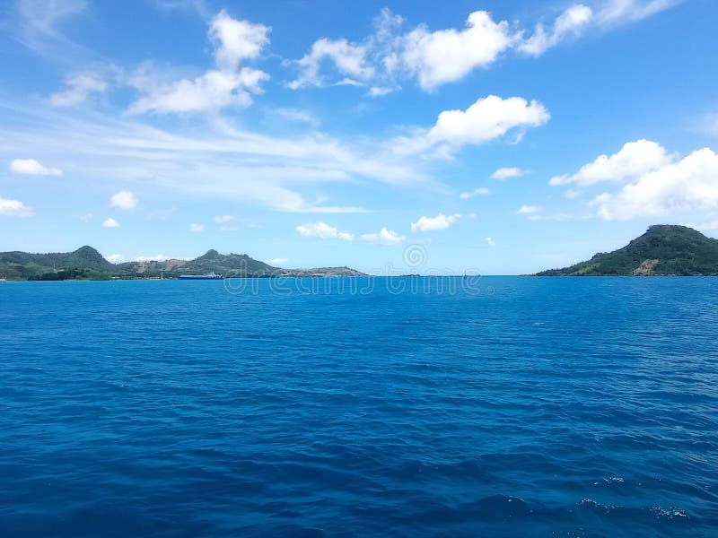 Ocean blue island sky fish stock photo. Image of ocean - 263339536