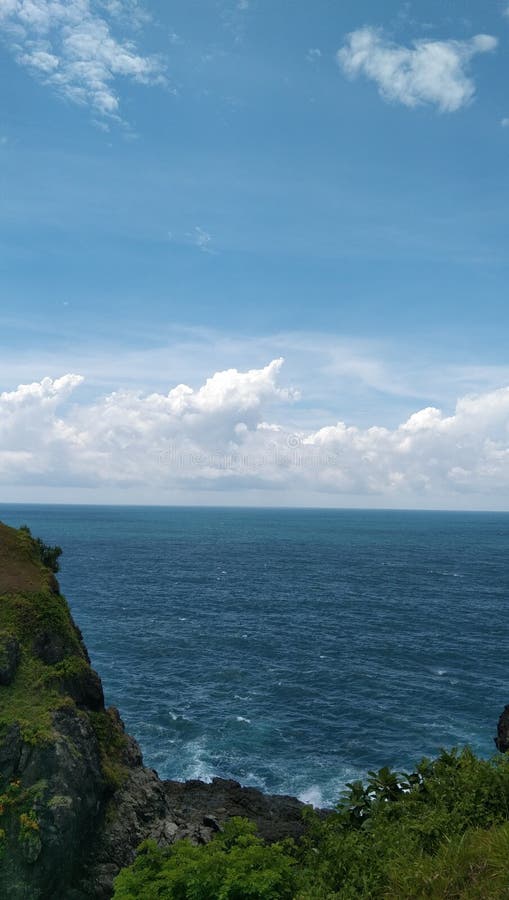 Ocean blue over the hill stock image. Image of terrain - 263663459