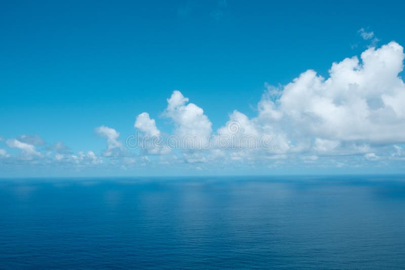 Ocean, blue sky and clouds stock photo. Image of ocean - 232257942