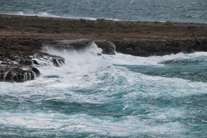 Ocean with Blue Water during a Storm, Big Waves Hitting the Rocks on ...
