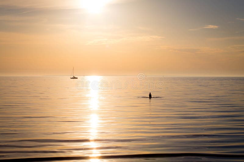 Ocean boy in sunset light stock image. Image of nature - 265827921