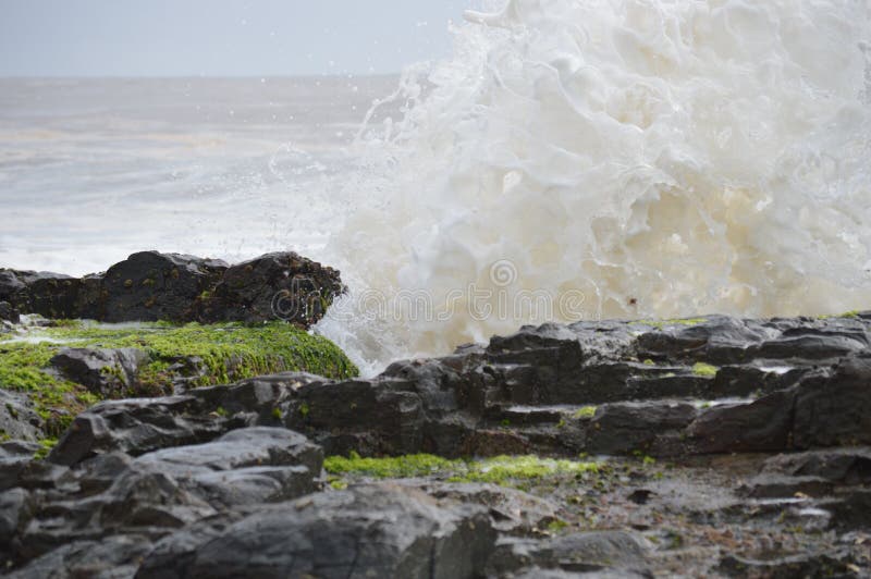 Ocean Breaking on Rocks stock photo. Image of smooth - 39146502