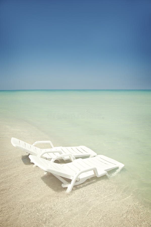 Ocean and Chairs on a Tropical Holiday Stock Photo - Image of sand ...