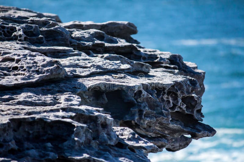 Oceanside Rocky Cliff Top with Blue Coastal Sea in Background Stock ...
