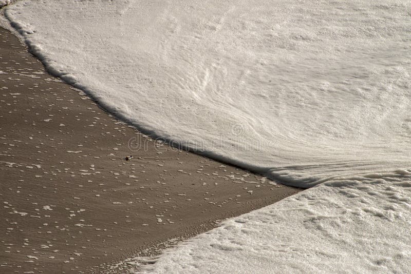 Ocean Foam from Waves in the Beach Sand Stock Photo - Image of water ...