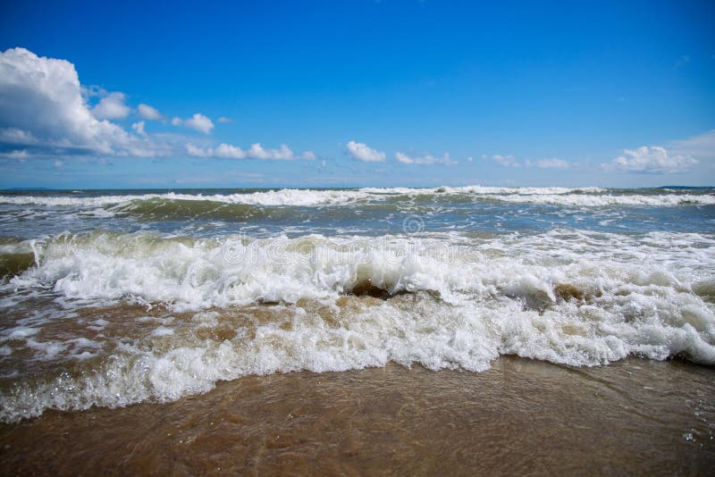 Foamy Waves Washing the Sandy Shore of the Ocean Stock Image - Image of ...
