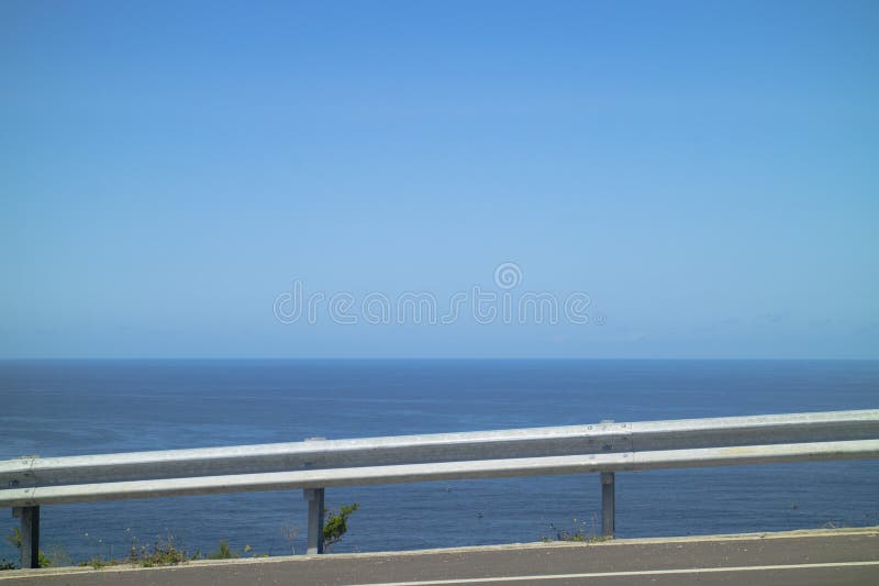 OCEAN HORIZON and the EMPTY ROAD Stock Image - Image of horizontal ...