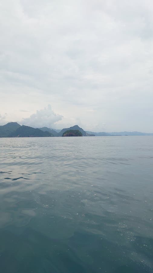 The Ocean and an Island that Looks Very Calm Stock Photo - Image of ...