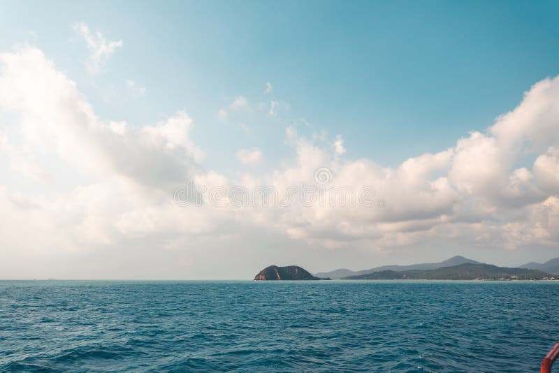 The Ocean and the Island, the Sun and the Waves in the Evening Stock ...