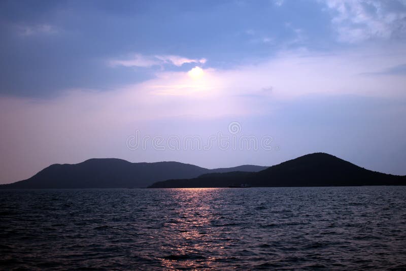 Ocean with Island and Sunset. Stock Photo - Image of atmosphere, sound ...