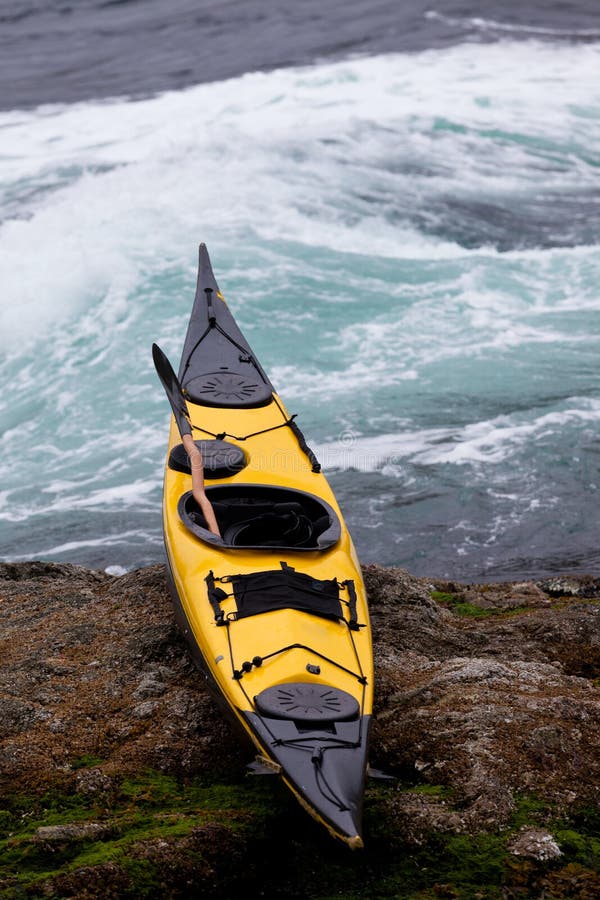 Ocean Kayak Beached on Rocky Shore at Tidal Rapids Stock Image - Image ...
