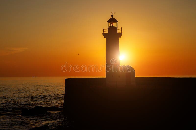 Ocean Lighthouse at the Sunset. Stock Photo - Image of evening, beach ...
