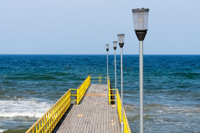 Ocean pier stock image. Image of yellow, wood, solitude - 19030643