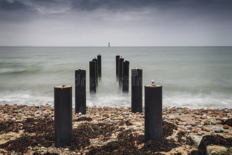 Ocean pier posts Sweden stock photo. Image of harbor - 140016670