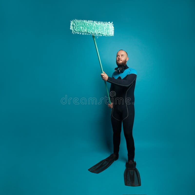 Ocean Pollution and Environmental Protection Concept. Diver with Mop on ...