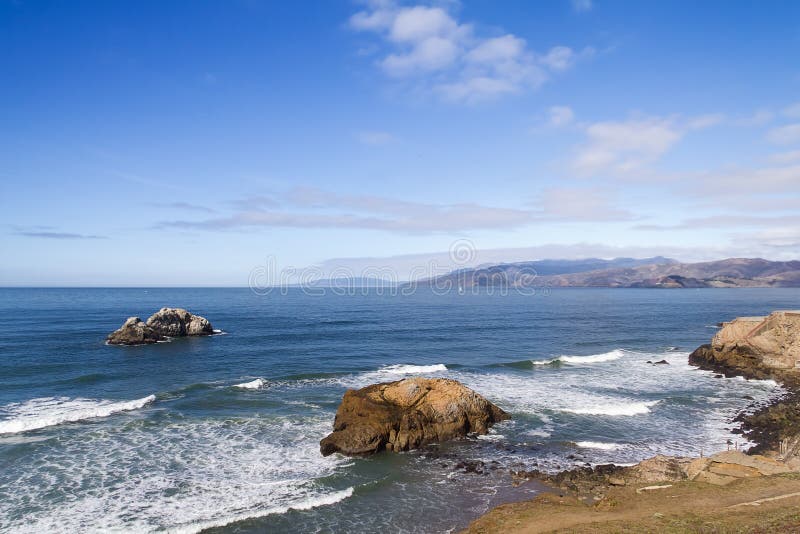 Ocean rocky shore stock photo. Image of ocean, skies - 18995716