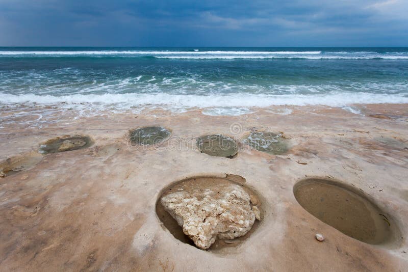 Ocean with Round Craters on the Shore Stock Image - Image of clear ...