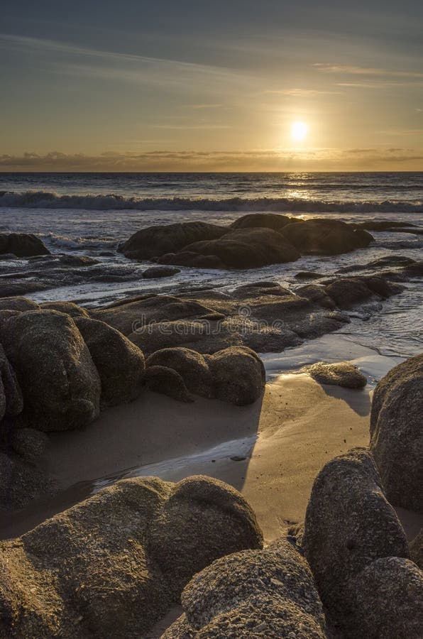Ocean sunrise with rocks stock photo. Image of landscape - 74107138