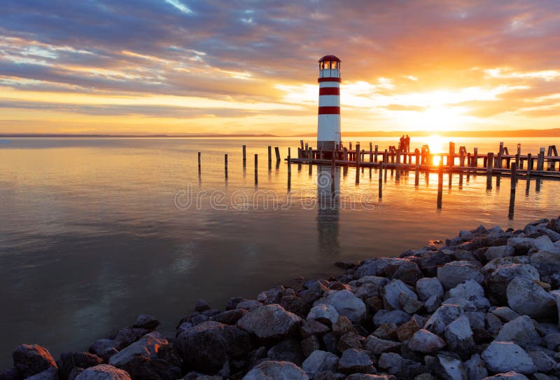 Ocean Sunset with Lighthouse Stock Photo - Image of lake, europe: 37930774