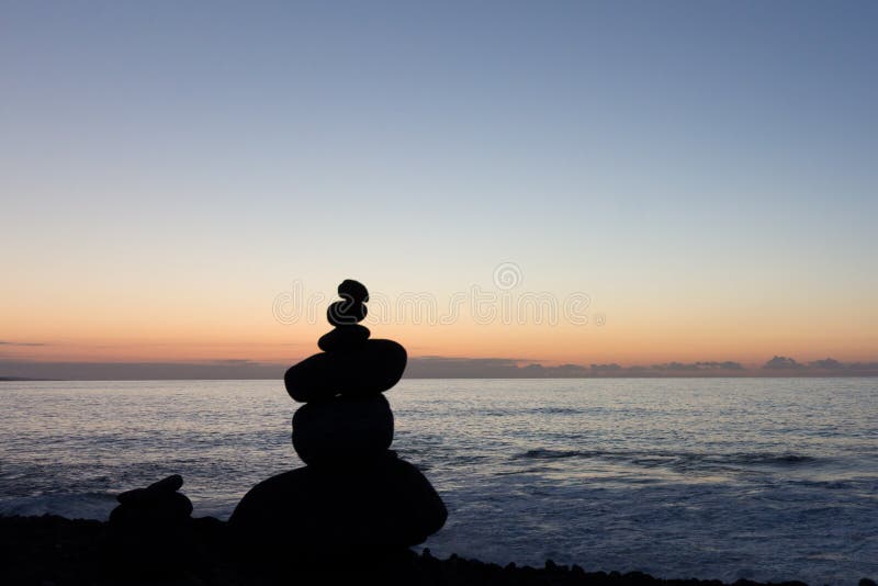 Ocean Sunset with Stacked Stone Silhouette Stock Photo - Image of black ...