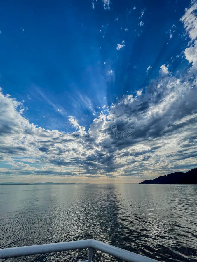 Ocean View from Boat Railing Under a Sky with Dramatic Clouds Stock ...