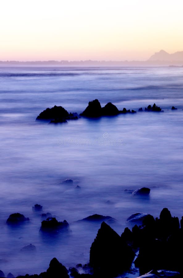 Ocean view at sunset. stock photo. Image of foam, rocks - 2069548
